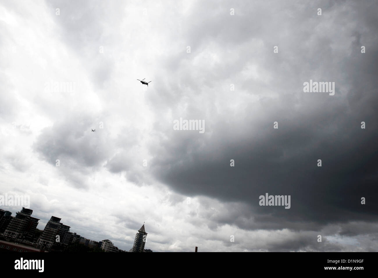 Helicopter in Storm Clouds Stock Photo - Alamy