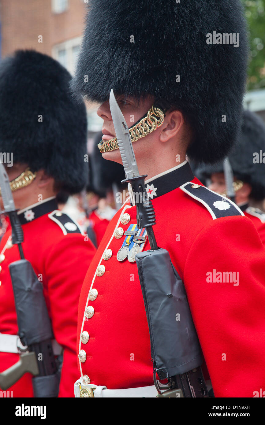 A member of the Coldstream Guards on parade with bayonet in Exeter, UK ...