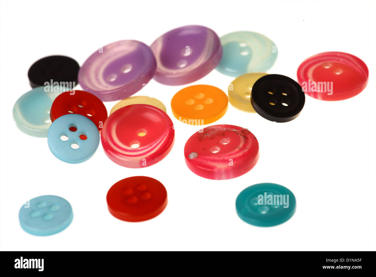 Color shot of many buttons isolated on white Stock Photo - Alamy