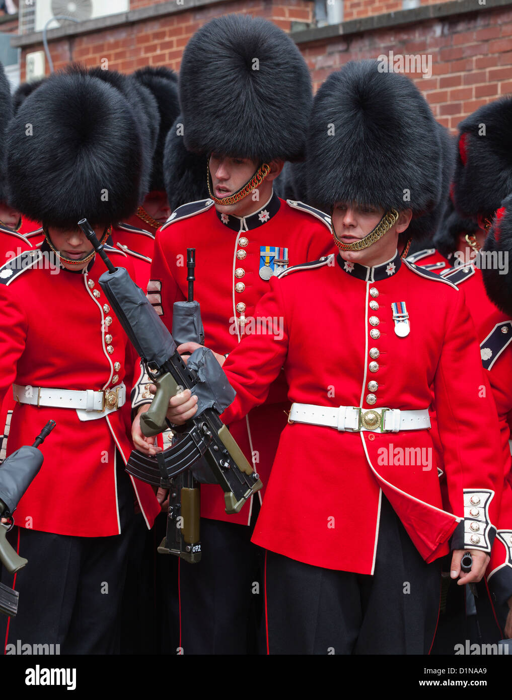 Coldstream Guards preparing to hand back guns after a parade in Exeter ...