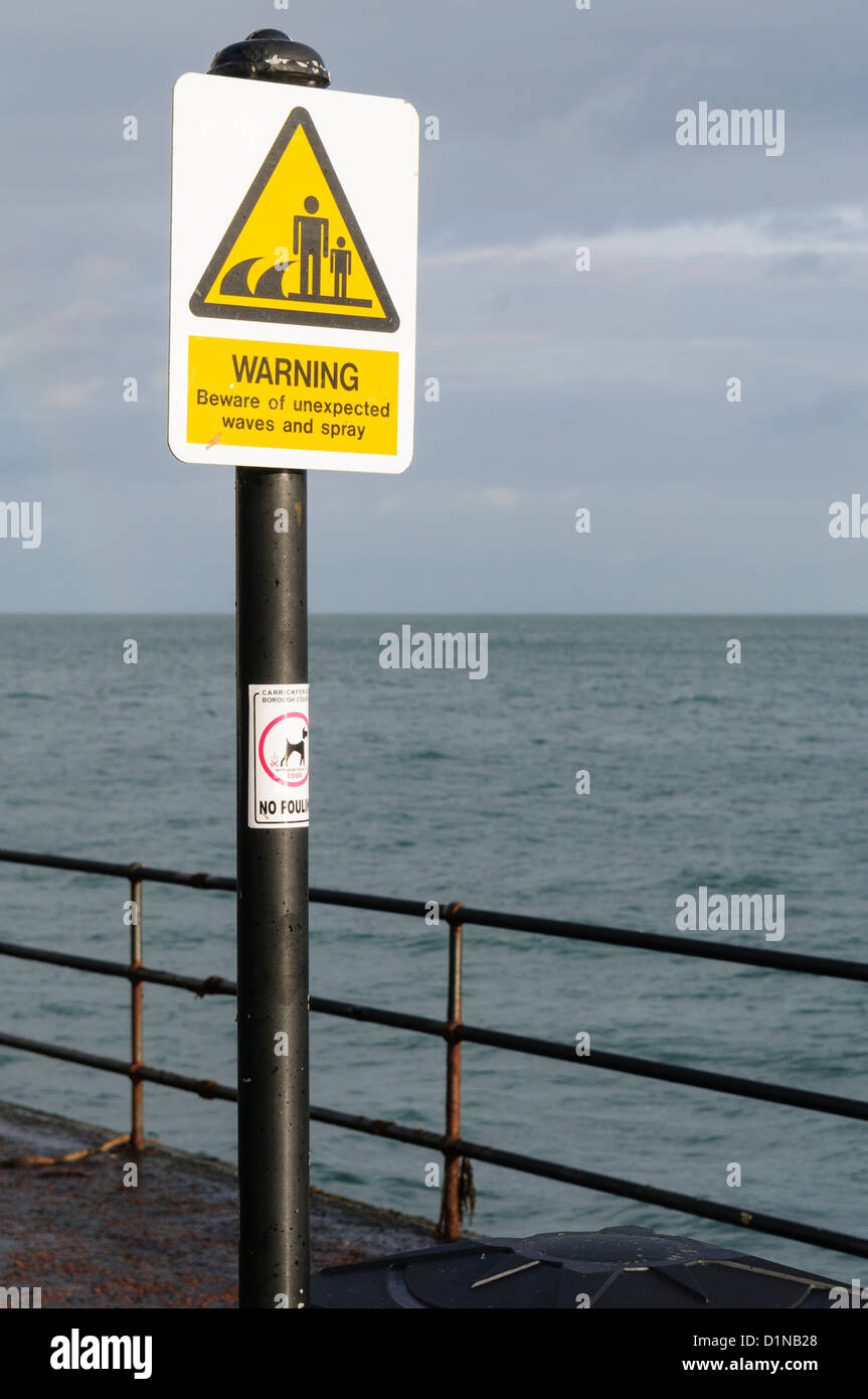 Sign warning the public of the danger of unexpected waves and spray ...