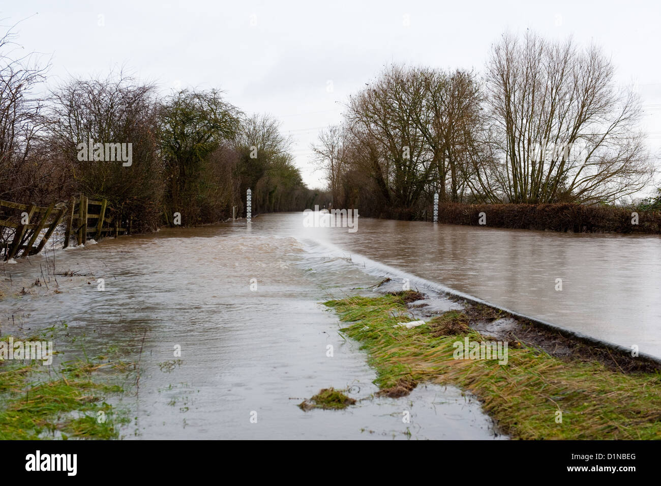 Flooded road and warning sign Stock Photo - Alamy