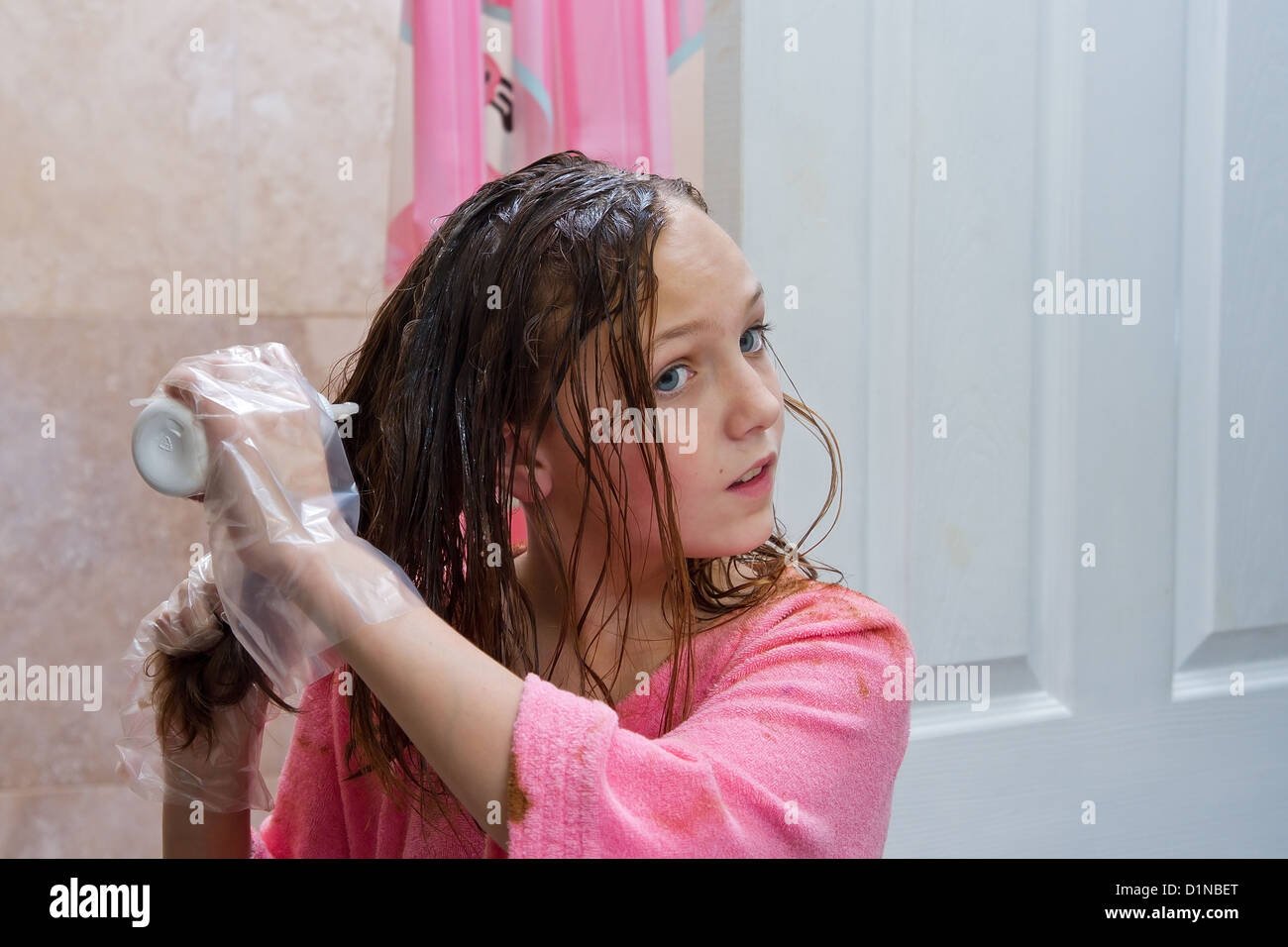 A Young Adolescent Caucasian Girl Dyes Her Hair For The First Time She Is Wearing A Pink