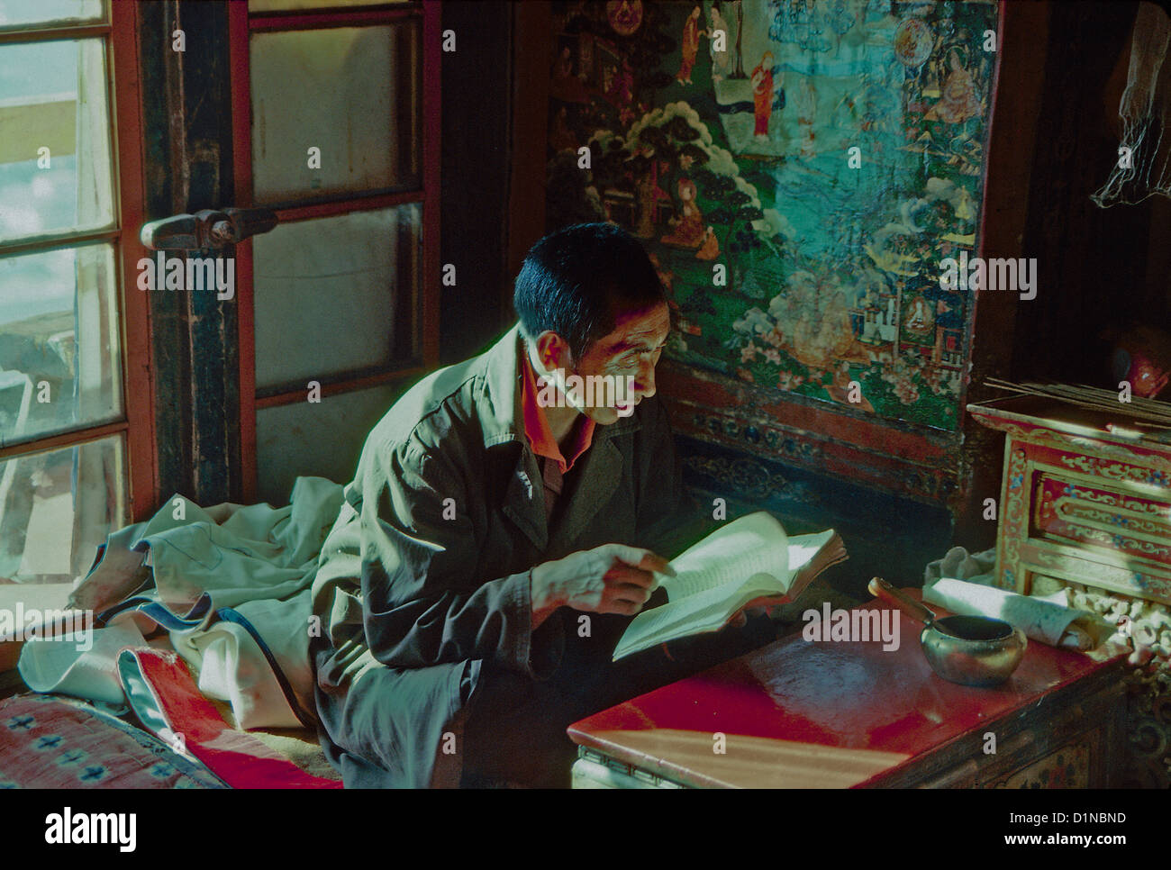 Young monk studying the ancient texts in the Potala Palace, Lhasa Stock ...