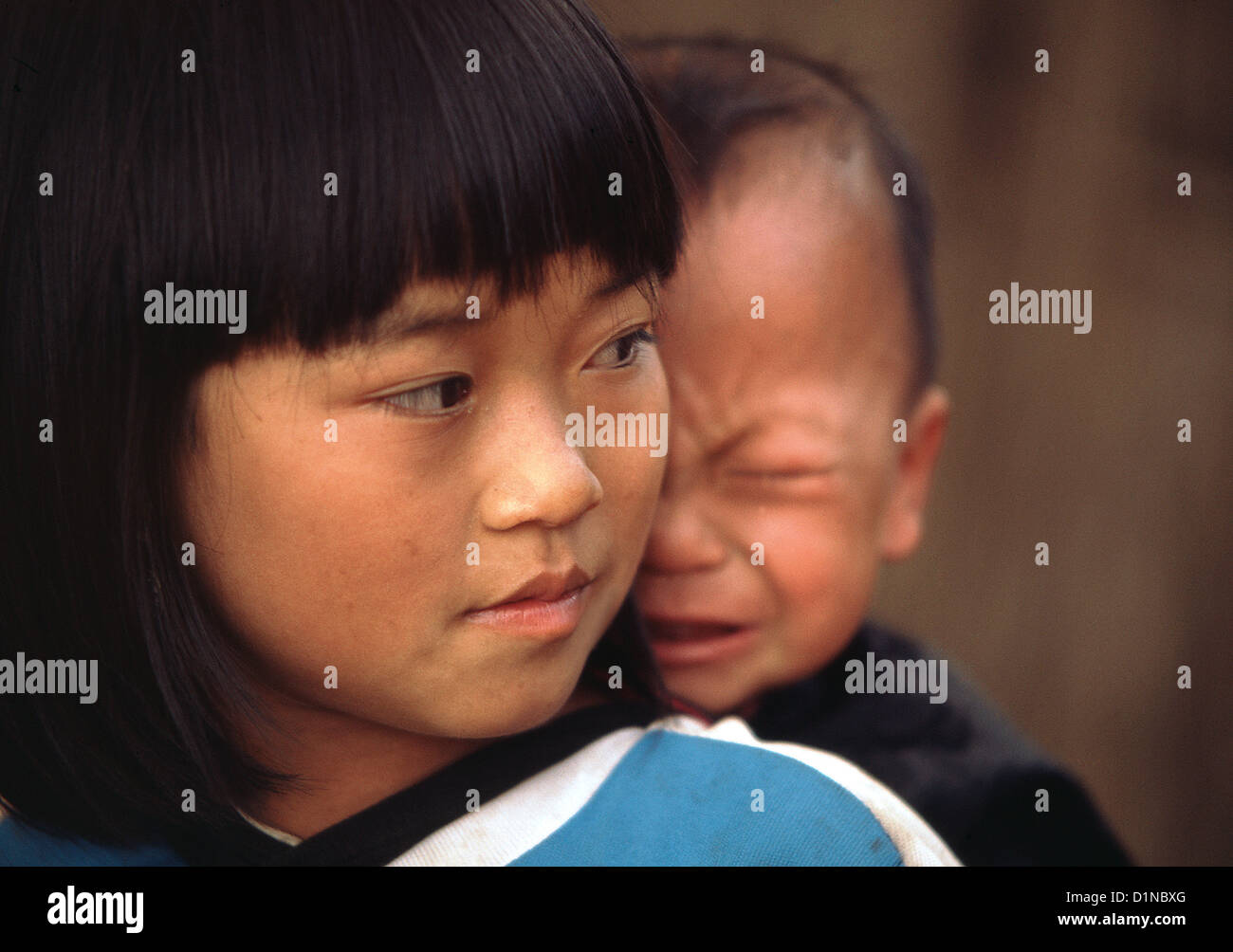 A young Mong girl and child in the Golden Triangle of Thailand Stock ...