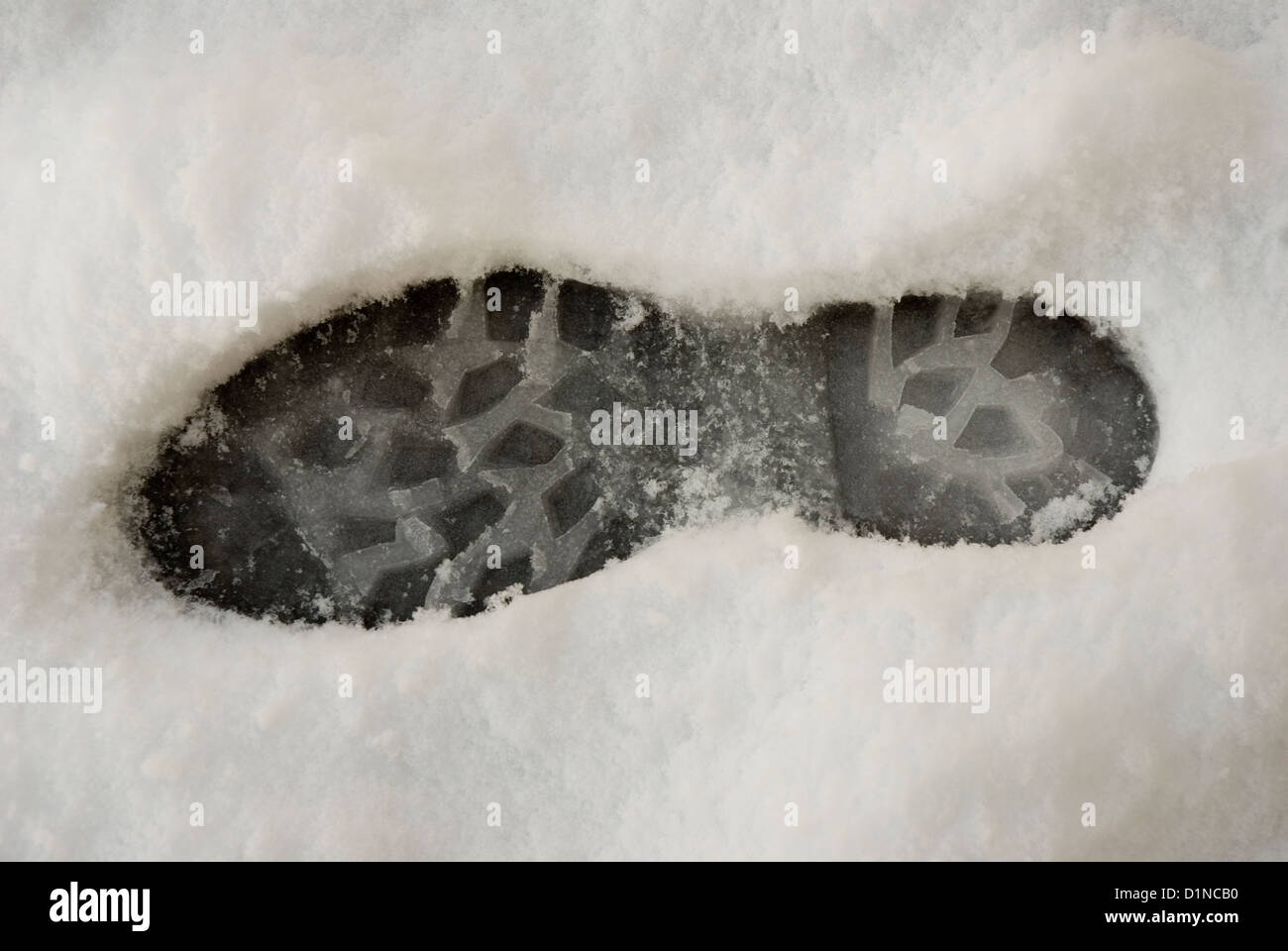 Boot print in snow Stock Photo - Alamy