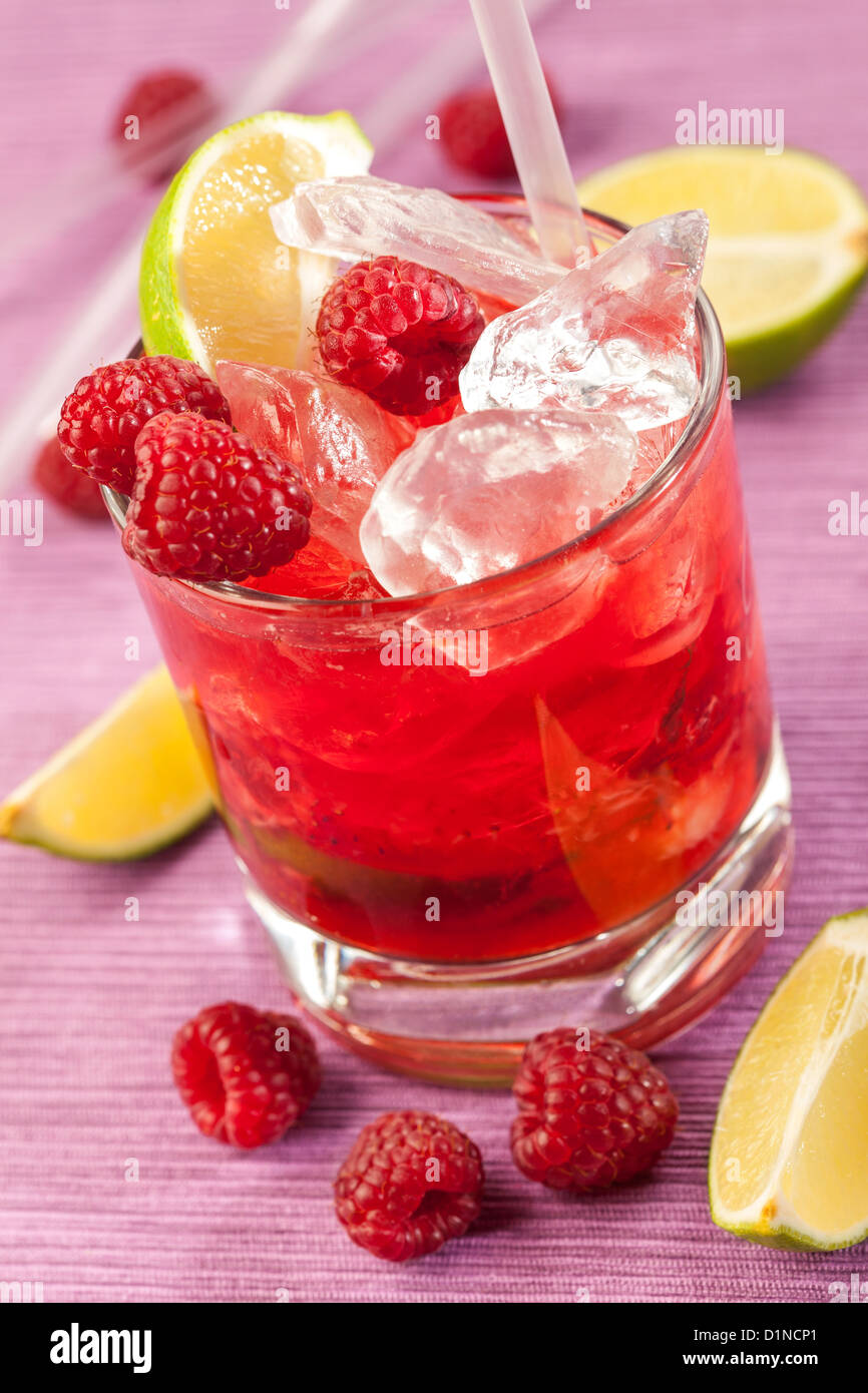 Red drink with raspberries and ice Stock Photo - Alamy