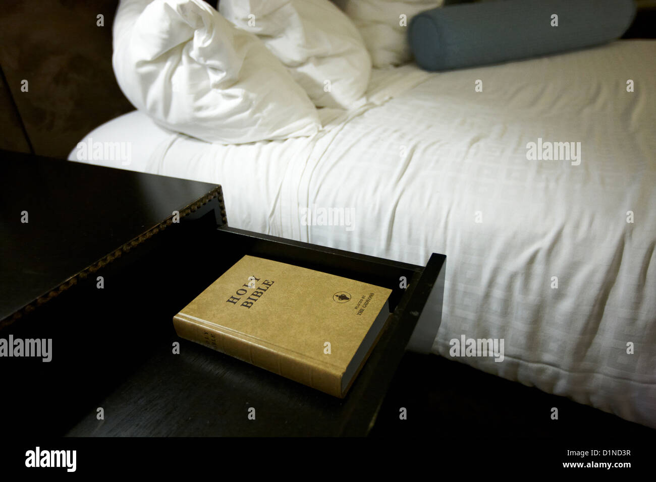 holy bible left by the gideons in a drawer at the side of the bed in a ...