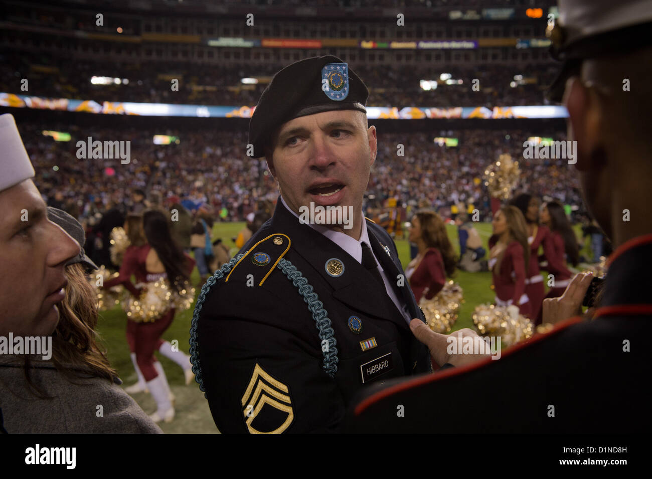 U.S. Army Staff Sgt. Shawn Hibbard talks with fellow service members ...
