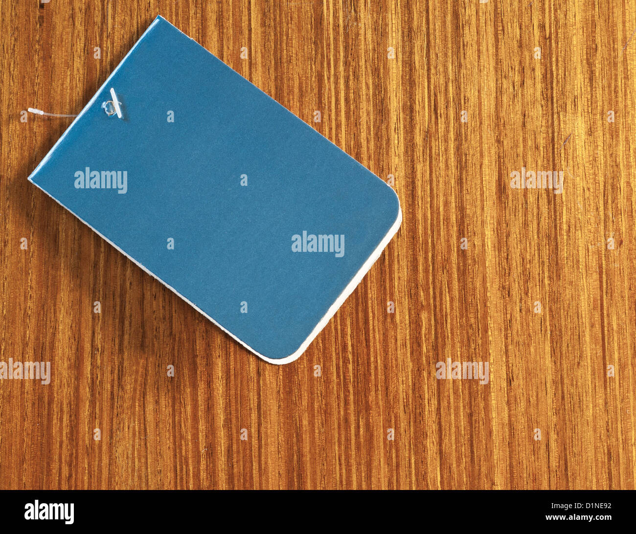 Blank blue label or price tag on wooden surface Stock Photo - Alamy