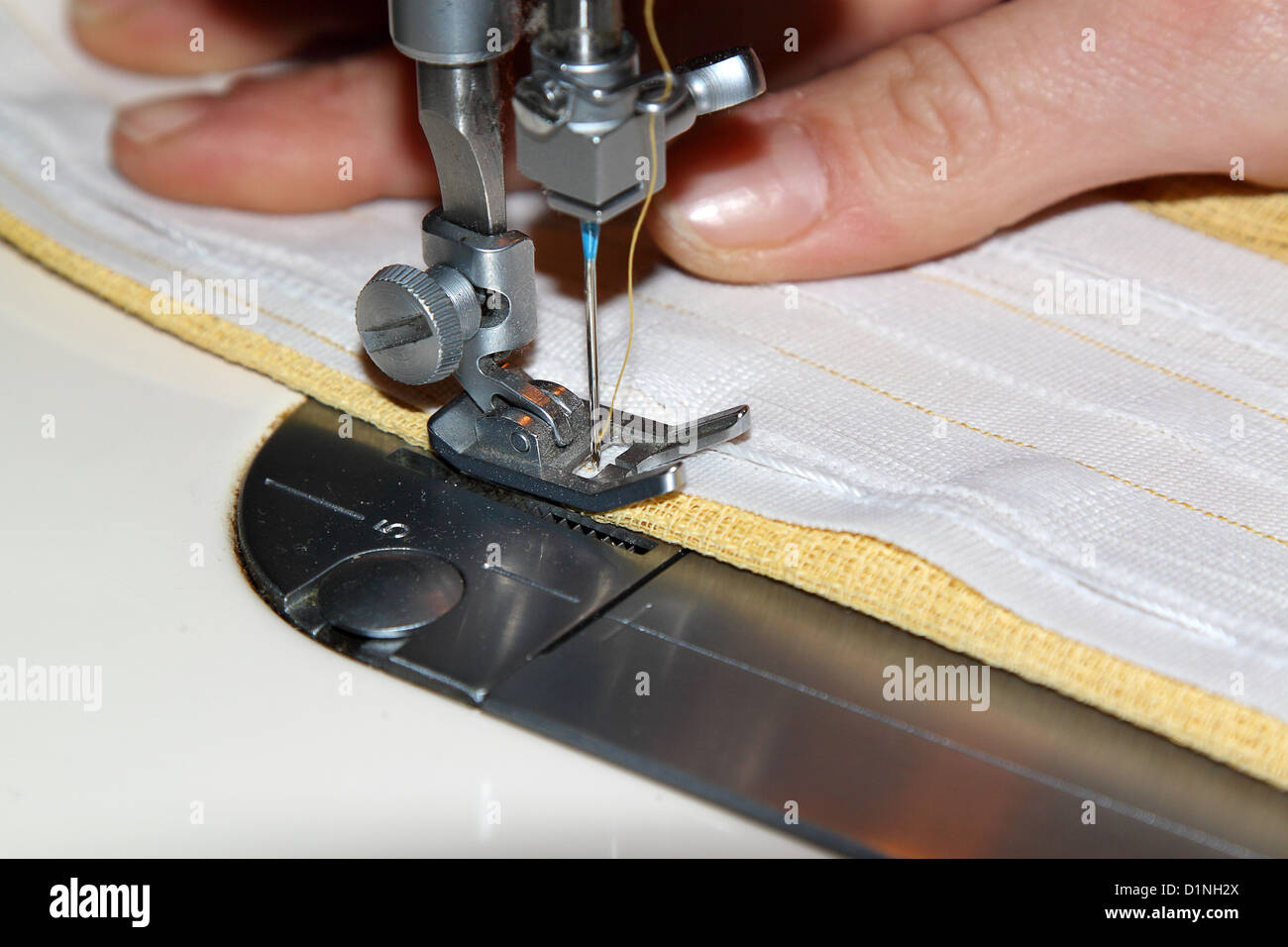 Tailor working with a sewing machine Stock Photo - Alamy