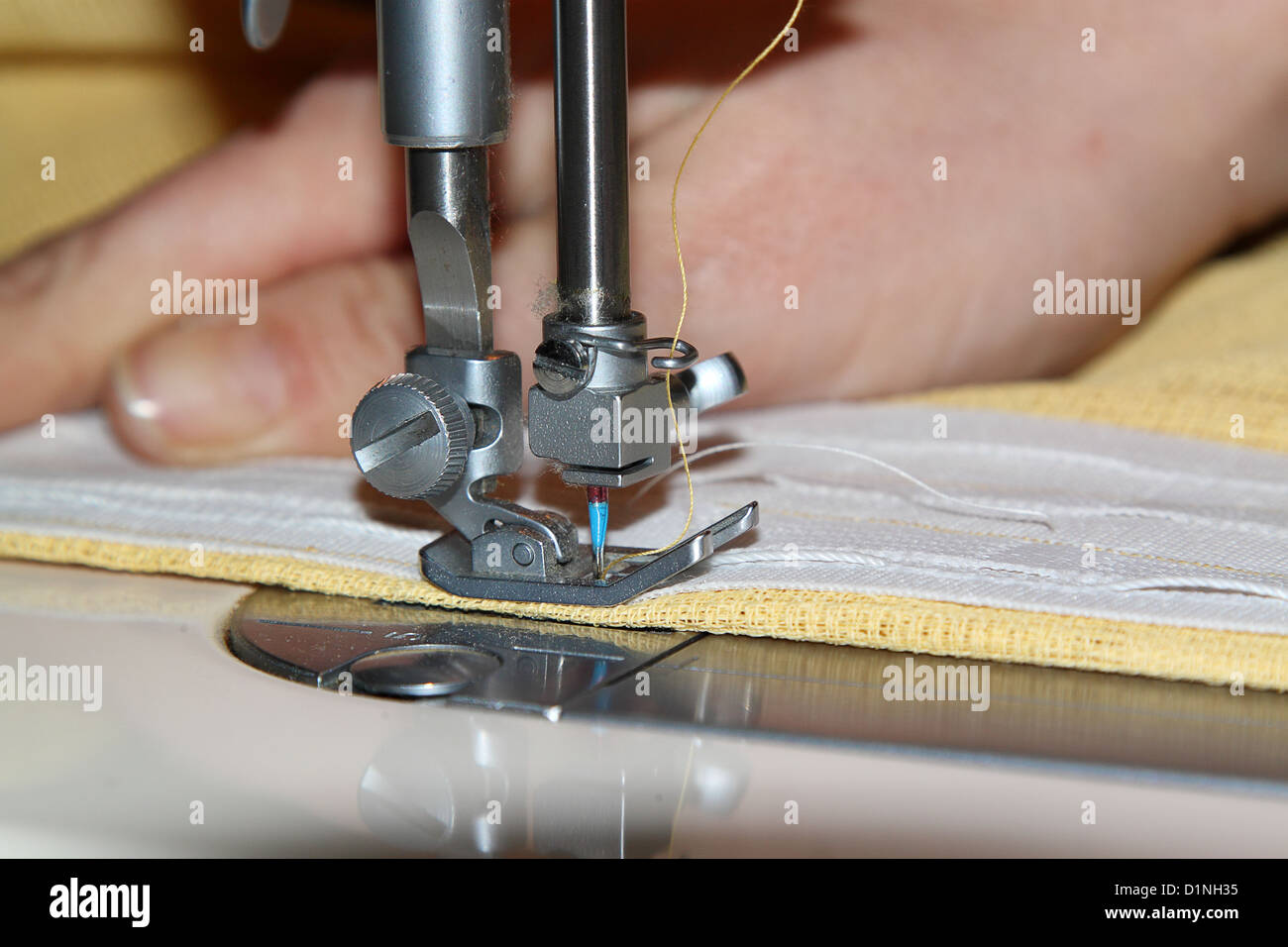 Tailor working with a sewing machine Stock Photo - Alamy