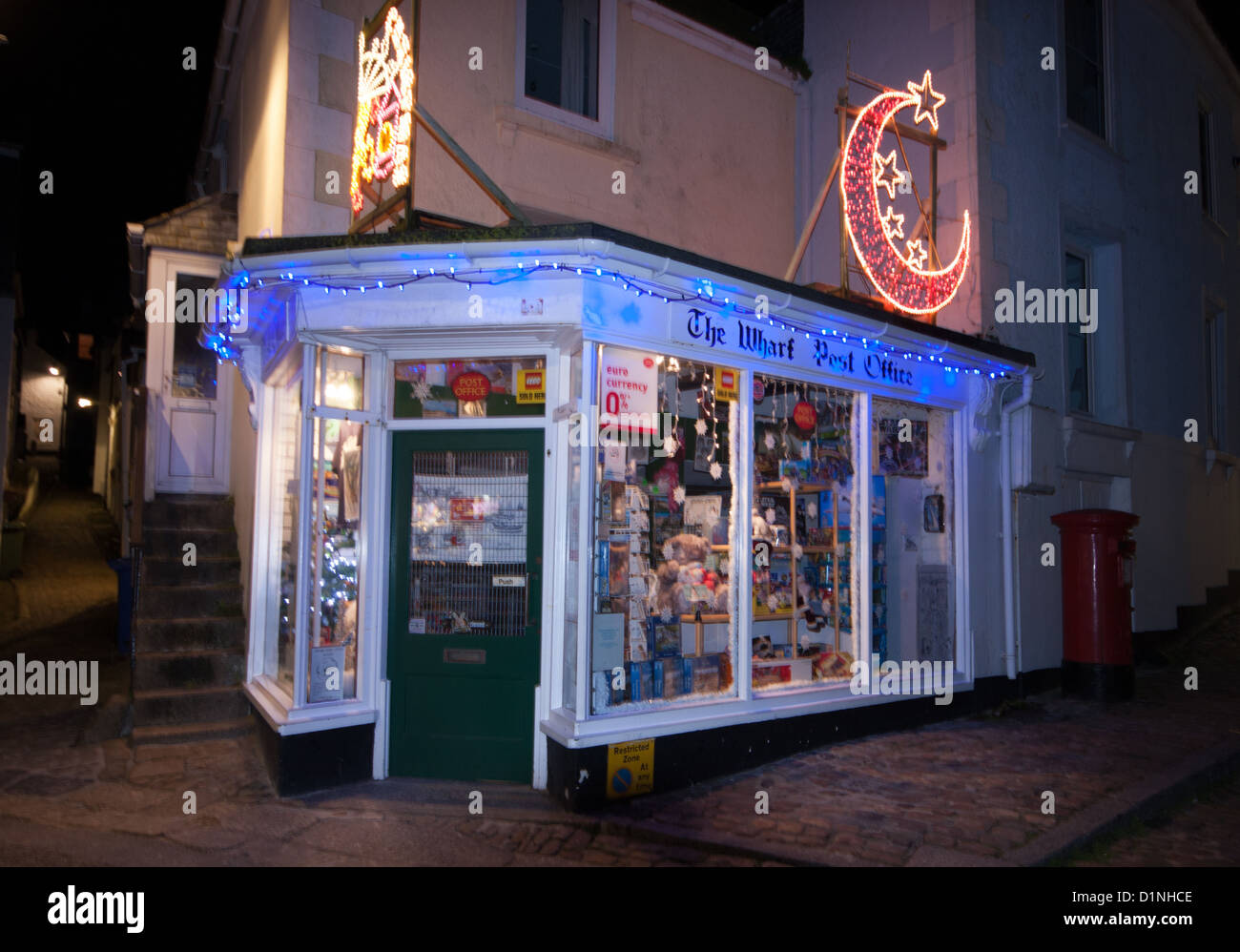 The Wharf Post Office, St. Ives, Cornwall, lit up at night for ... The Wharf Post Office, St. Ives, Cornwall, lit up at night for ...