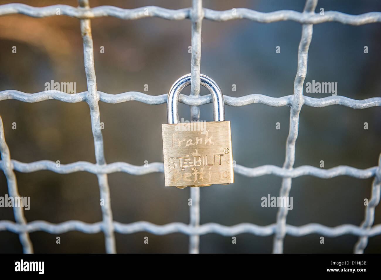 Padlocks on a Wire Fence Stock Photo - Alamy
