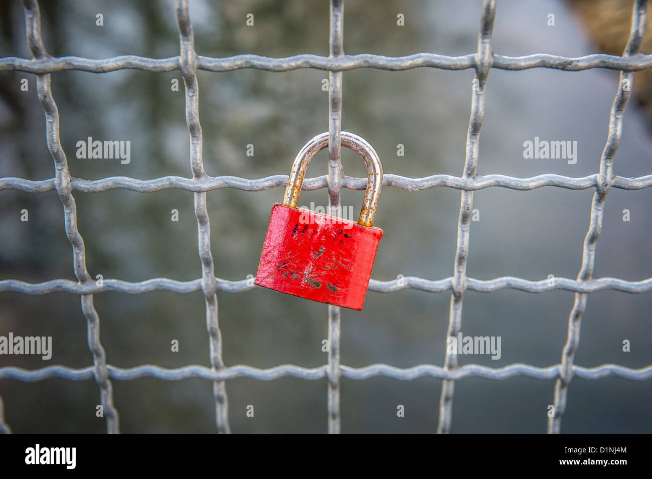 Padlocks on a Wire Fence Stock Photo - Alamy