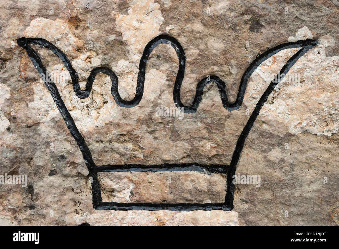 Crown in relief on stone Stock Photo - Alamy