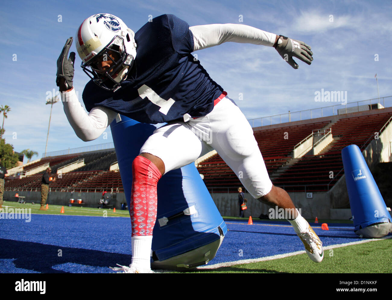 Wide receiver Corey Cooper stiff-arms a defender during the first ...