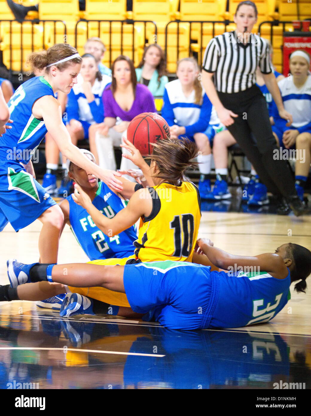 Joyce Iamstrong (30) scrambles for a loose ball with Kristina Wells (10 ...