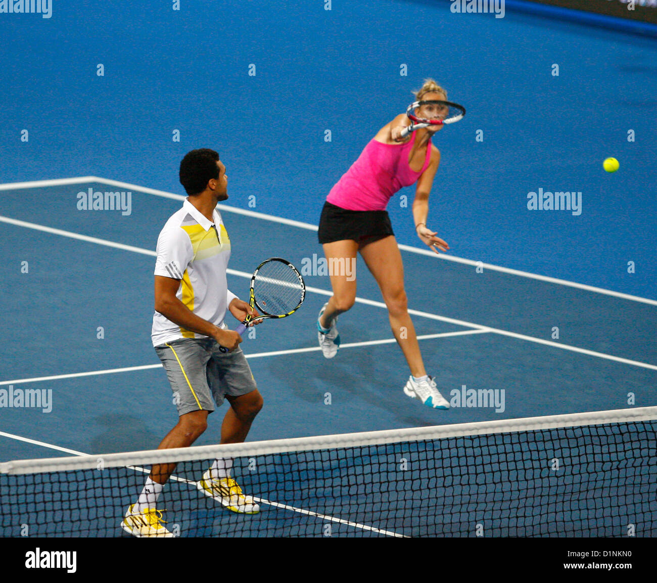 01.01.2013 Perth, Australia. Jo-Wilfred Tsonga and Mathilde Johansson (FRA) in the mixed doubles ...