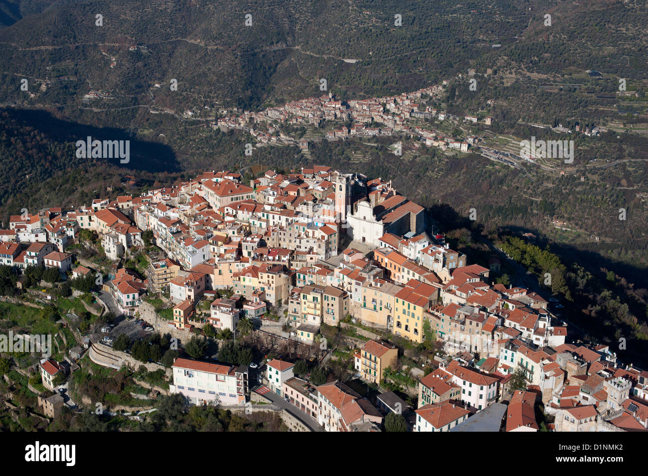 AERIAL VIEW. Perched medieval villages of Perinaldo (highest) and ...