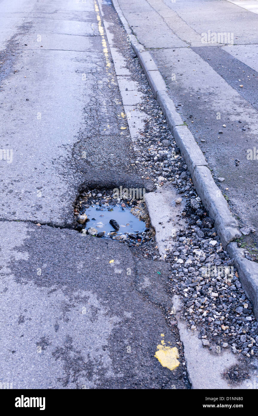 Pothole in the road Stock Photo - Alamy