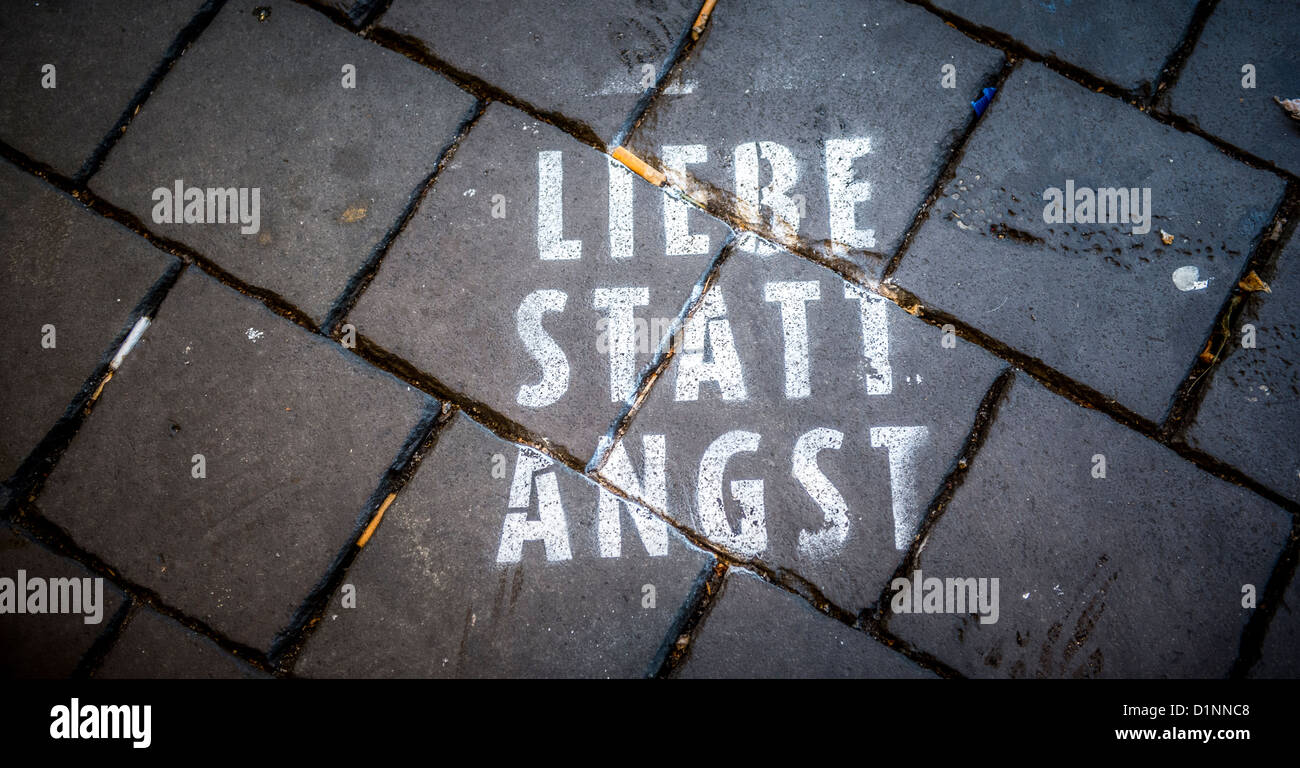 Stenciled German Pavement Liebe Statt Angst Stock Photo - Alamy