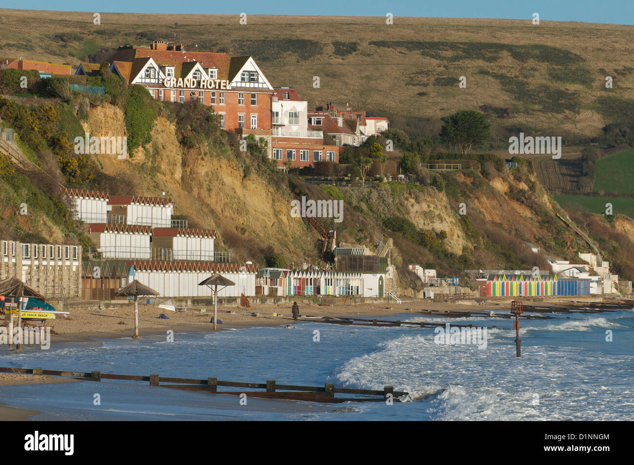 Grand hotel Swanage bay on cliffs and beach huts below Stock Photo - Alamy