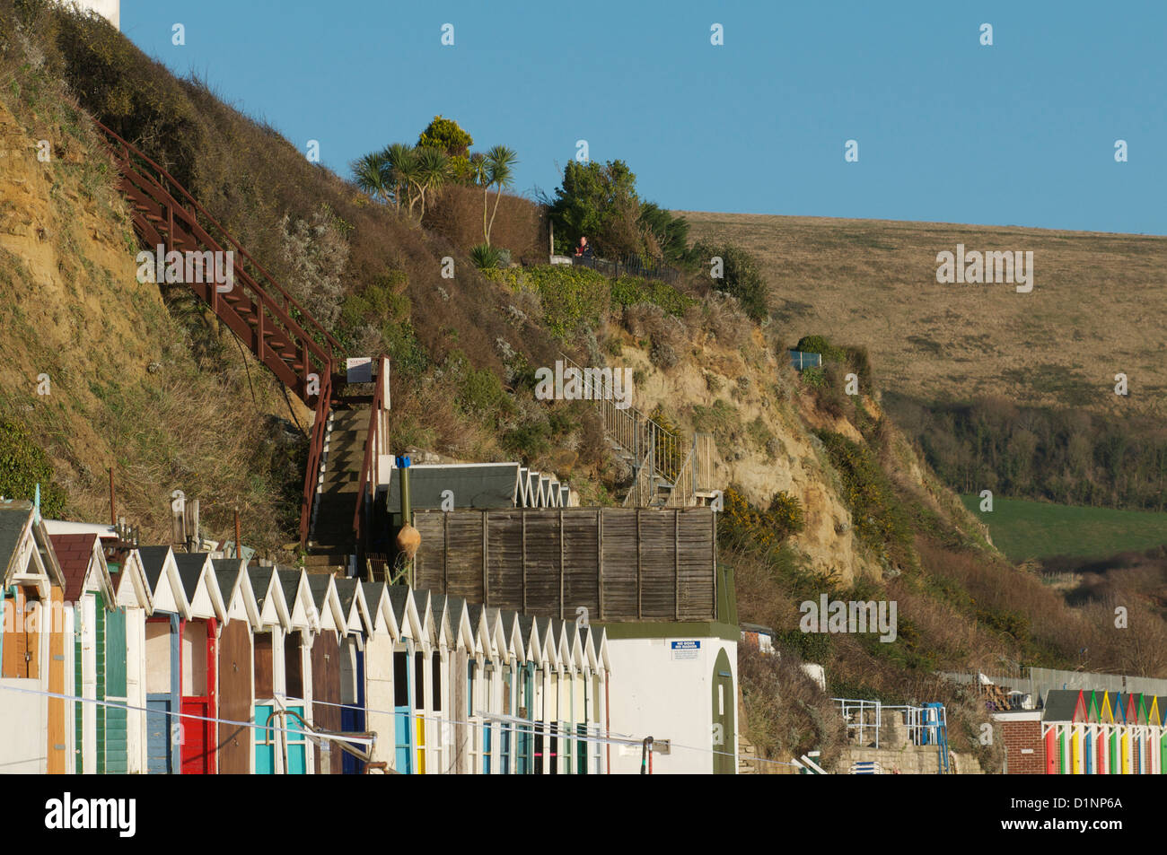 Swanage cliffs and beach huts at the northern end of Swanage bay Stock ...