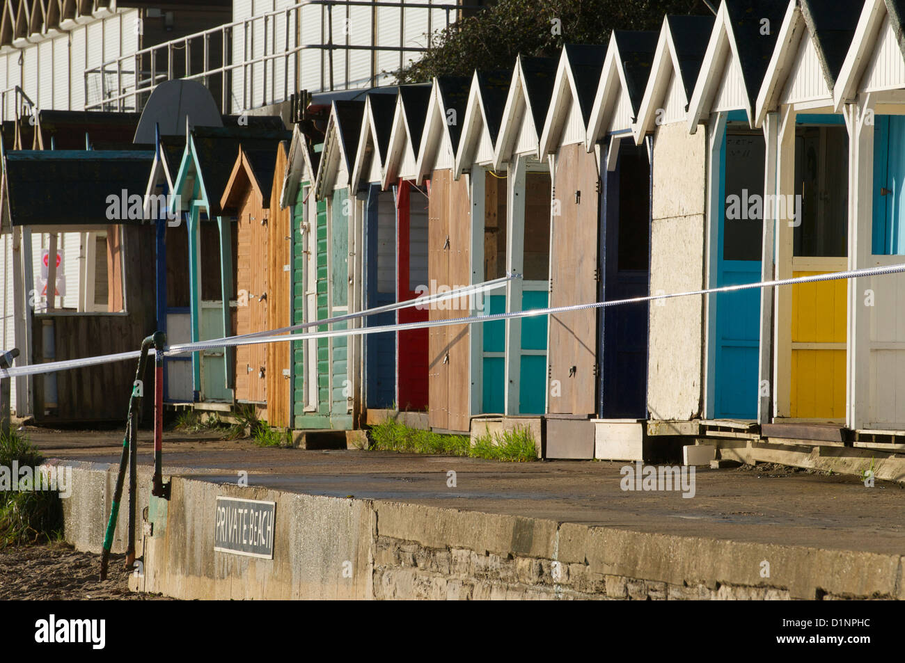 Swanage beach huts at the northern end of Swanage bay Stock Photo - Alamy