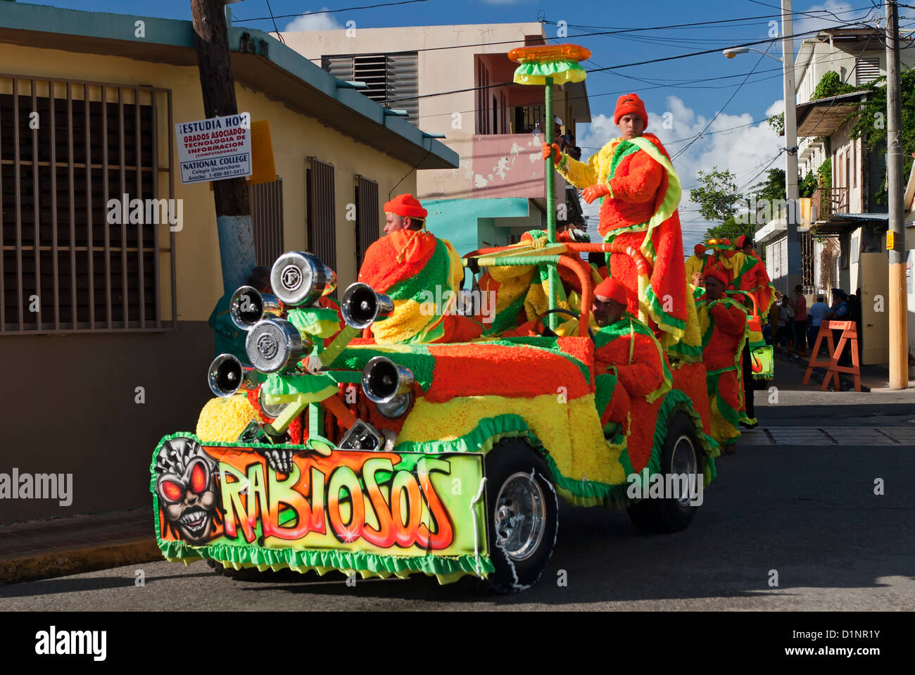 Men in traditional costume on colorful float, Hatillo Mask Festival ...