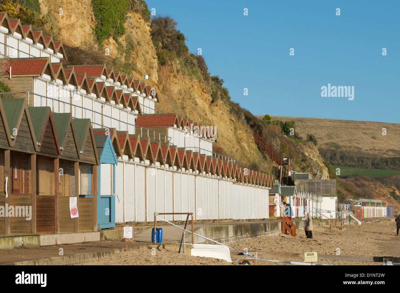 Swanage cliffs and beach huts at the northern end of Swanage bay Stock ...