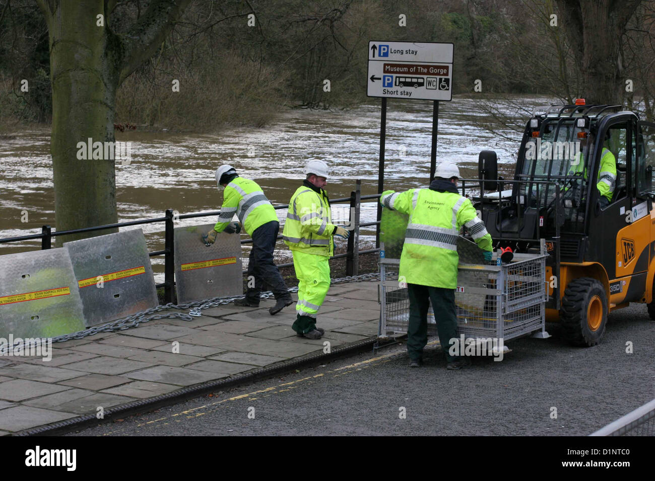 Ironbridge,UK. 1st Jan, 2013. Reinforcing flood defences against an ...