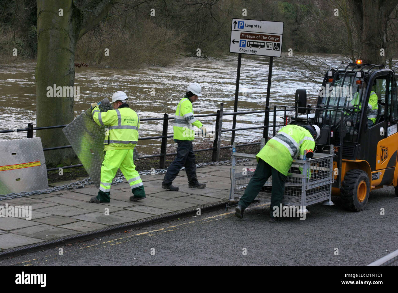 Ironbridge,UK. 1st Jan, 2013. Reinforcing flood defences against an ...