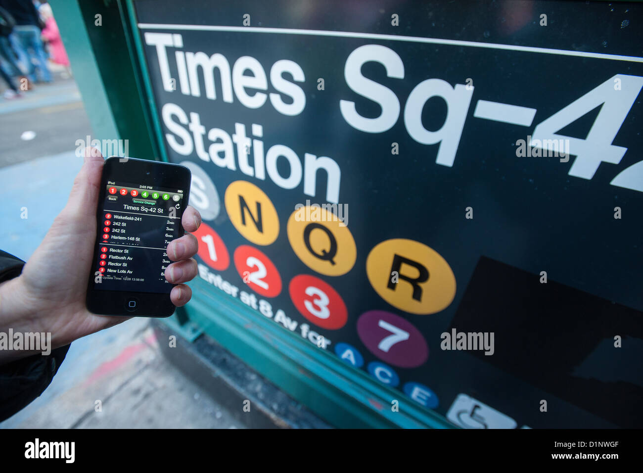 A subway rider checks the new MTA Subway Time app outside the Times ...