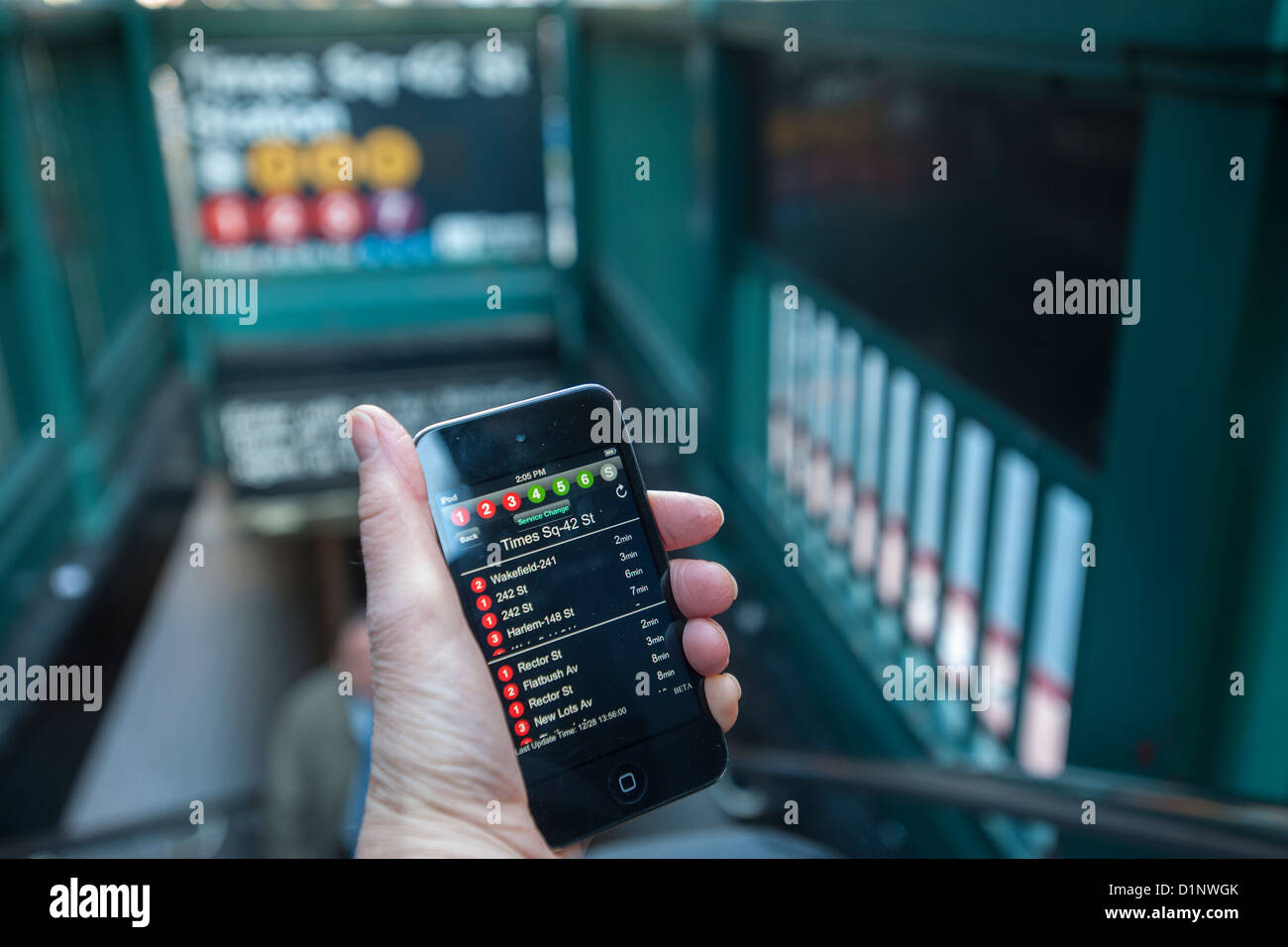 A subway rider checks the new MTA Subway Time app outside the Times ...