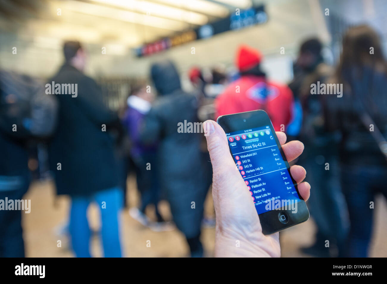 A subway rider checks the new MTA Subway Time app outside the Times ...