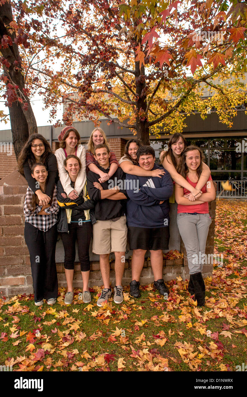 Multi-ethnic California high school students pose for a classmate's ...