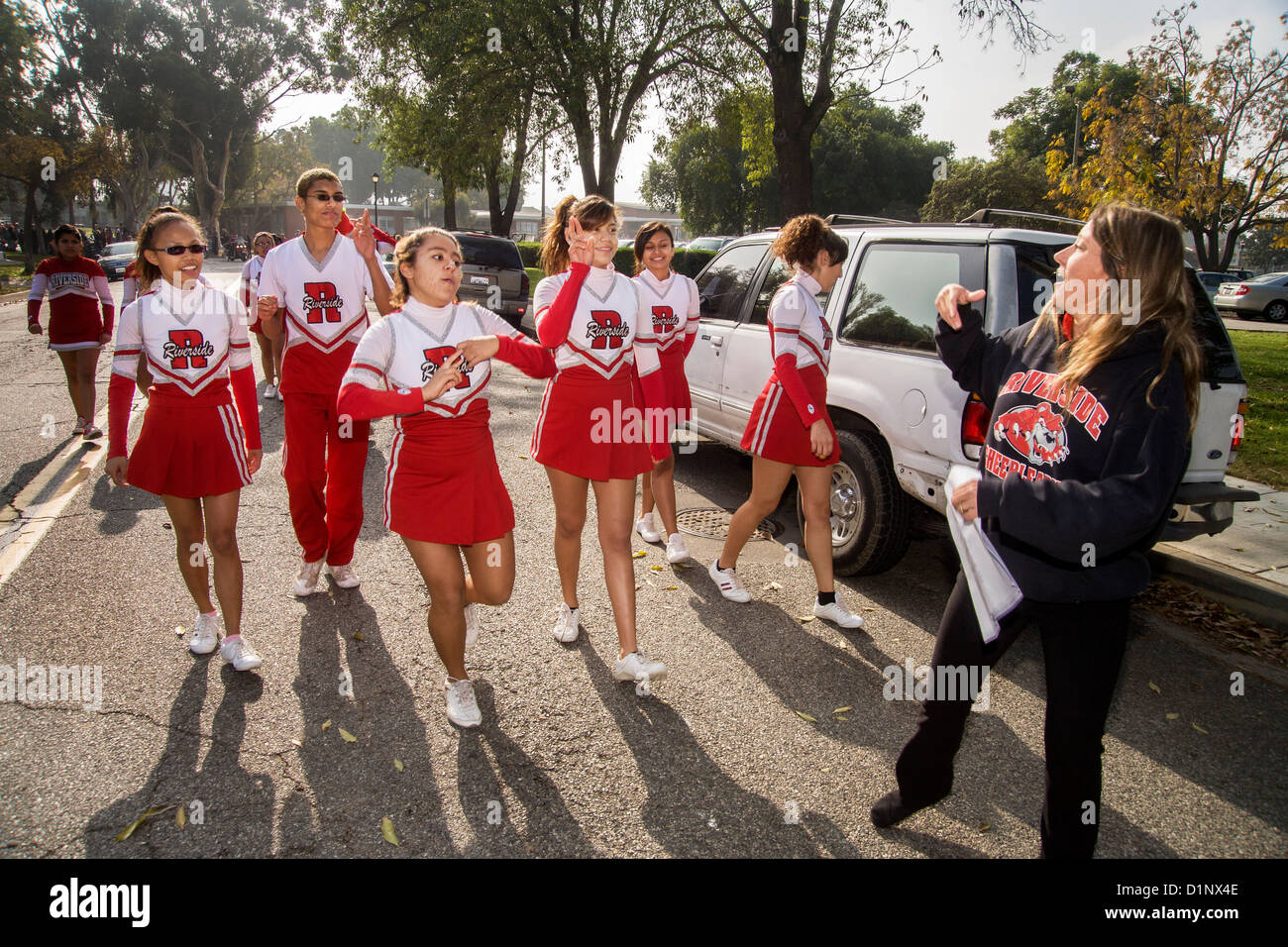 Coach of team of deaf cheerleaders directs them with sign language ...