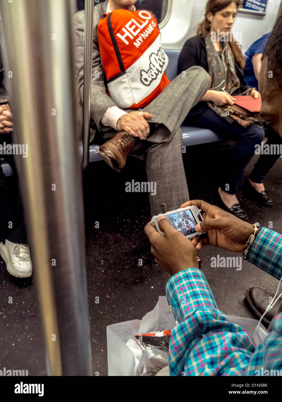 Video games on the subway hi-res stock photography and images - Alamy
