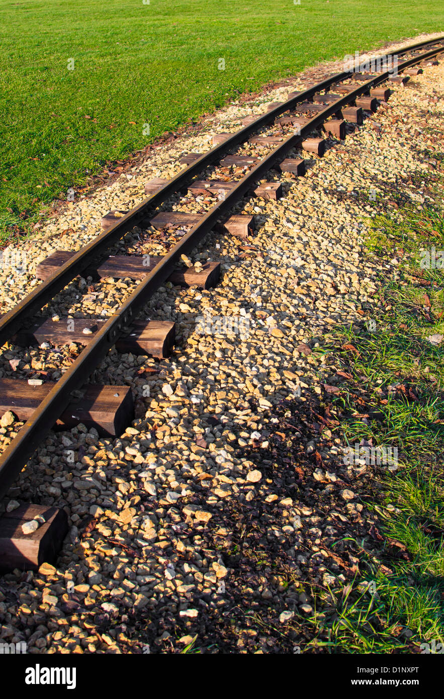 Rusty Train Tracks Through Meadow Stock Photo - Alamy