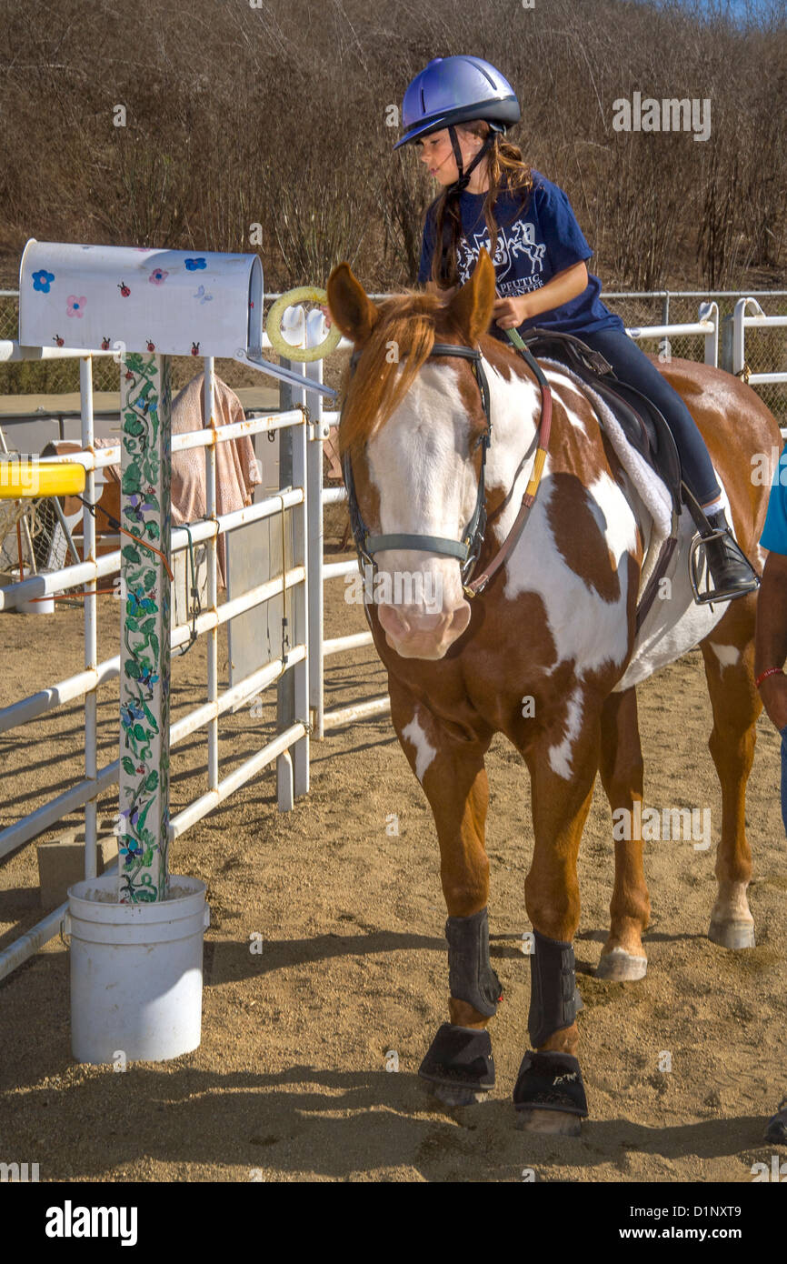 A girl afflicted with a liver tumor and high-function autism rides a ...