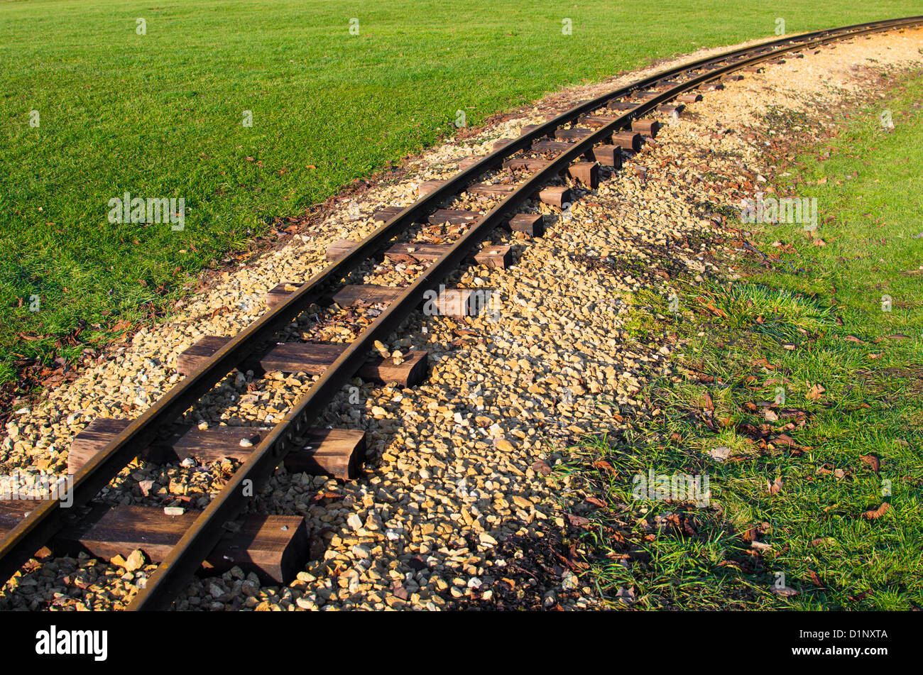 Rusty Train Tracks Through Meadow Stock Photo - Alamy