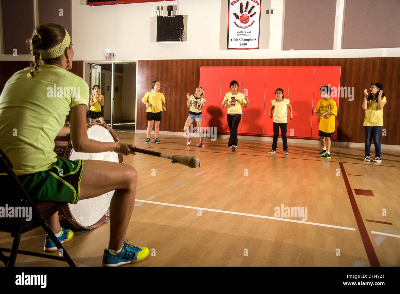 Prompted by an instructor in sign language, a hearing-impaired middle ...