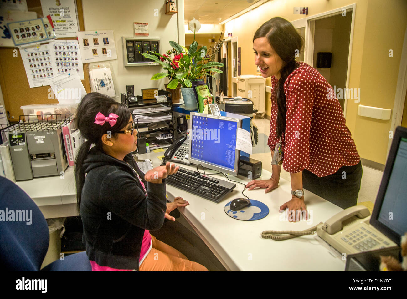 A Vietnamese American charge nurse and an administrator argue at a ...
