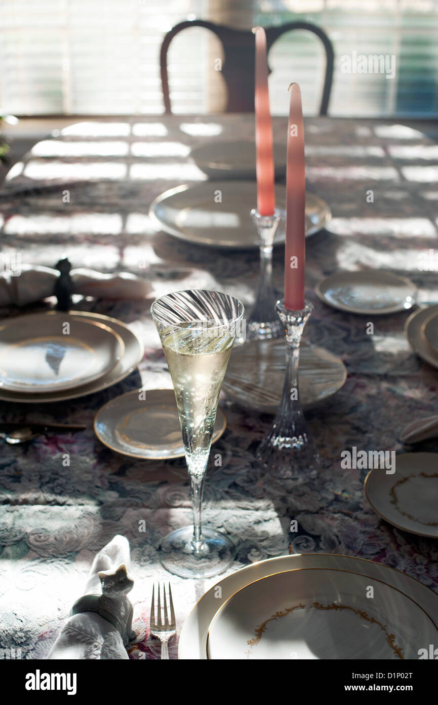 Formal table setting with strong light shinning through the window ...