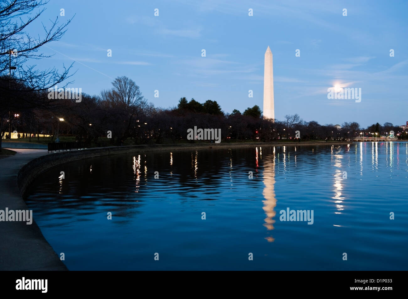 Washington Monument and moon at dusk with reflection in the tidal basin ...