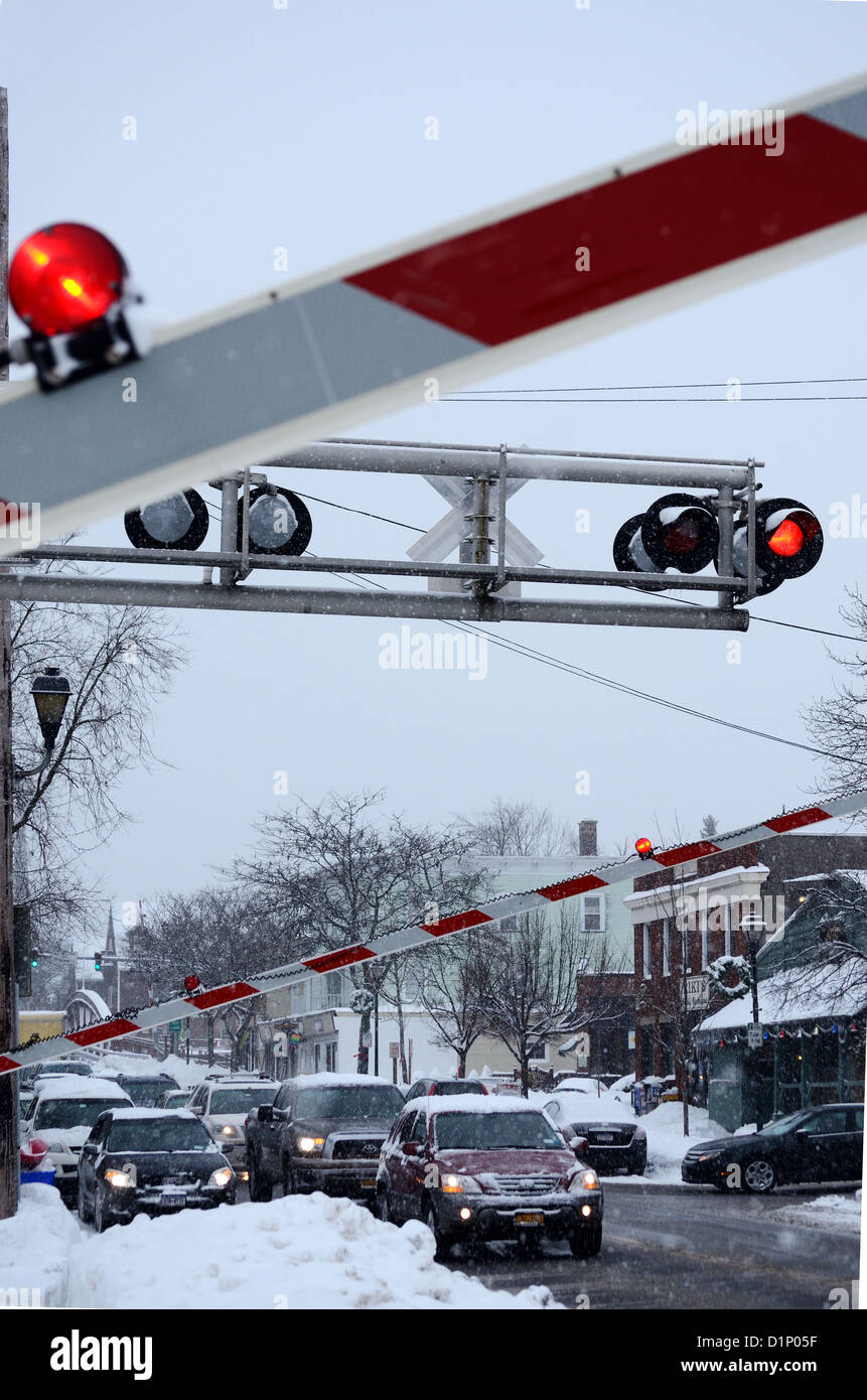 Caution signals and barrier for train crossing Stock Photo - Alamy