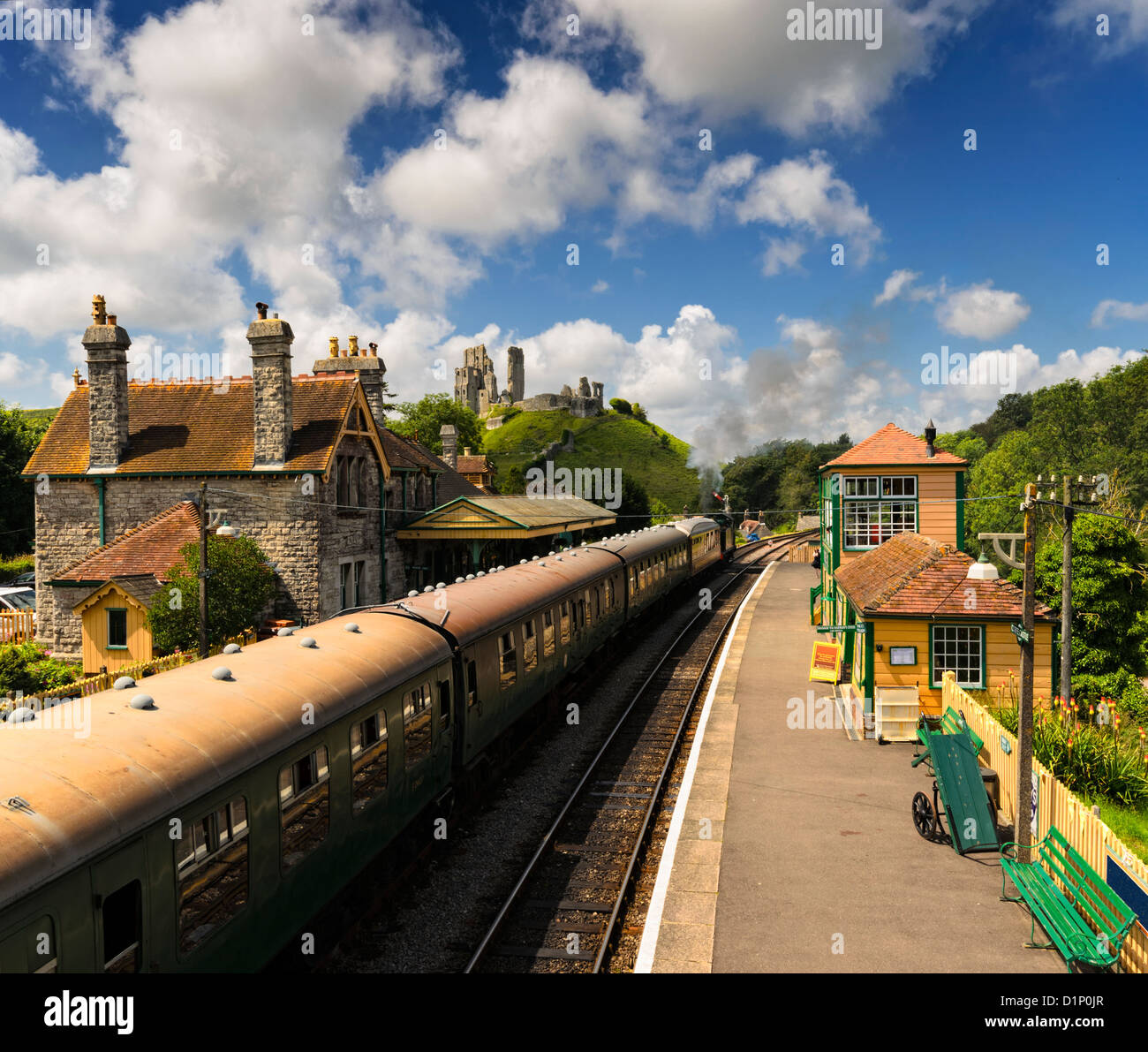 A steam train pulls in to the station at Corfe Castle in Dorset Stock ...