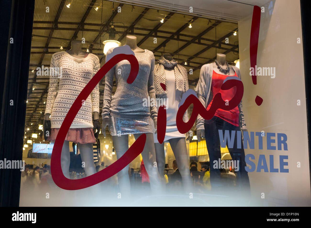 Sale sign in the window of a women's clothing store Stock Photo - Alamy