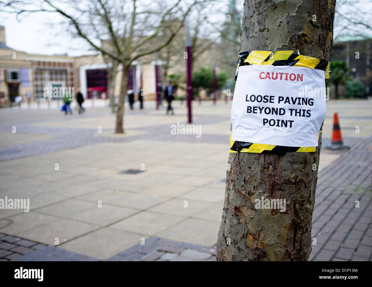A warning sign taped to a tree Stock Photo - Alamy